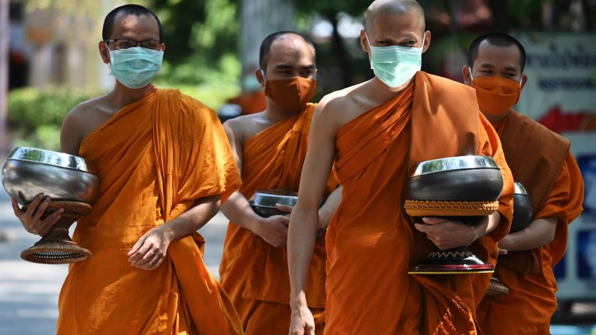 Thai Buddhist Monks Use Recycled Plastic For COVID-19 Masks | Al Bawaba