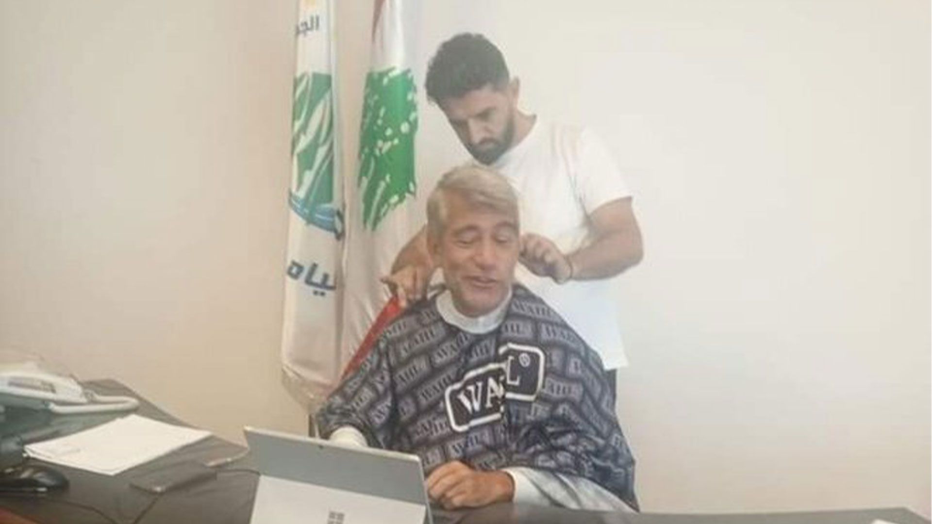 Lebanese minister sparks outrage for cutting hair inside office | Al Bawaba