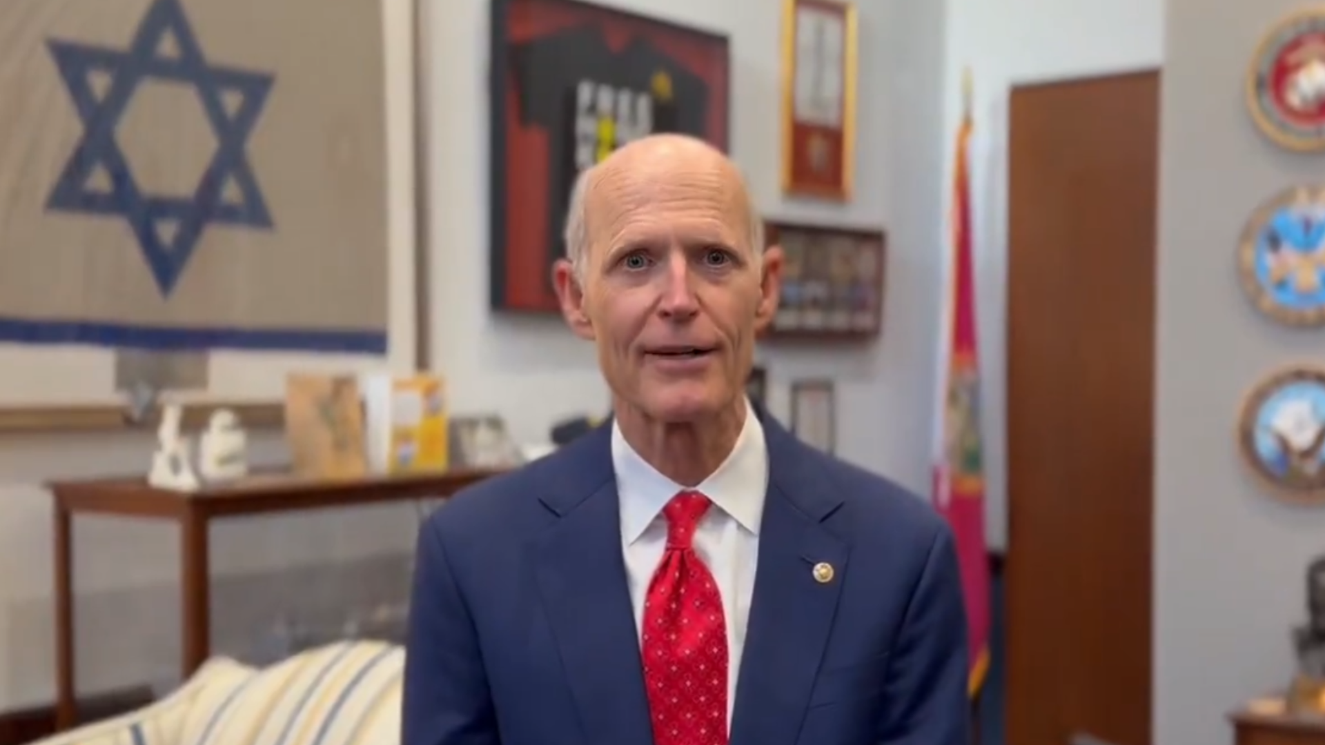 Rick Scott sparks outrage for displaying Israeli flag over US flag | Al ...