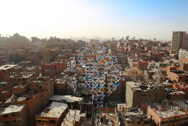 New mural in Cairo’s Garbage City spans over 40 buildings, helps ...
